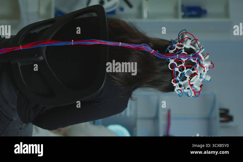 Vertical video: Back view of woman patient wearing performant eeg ...