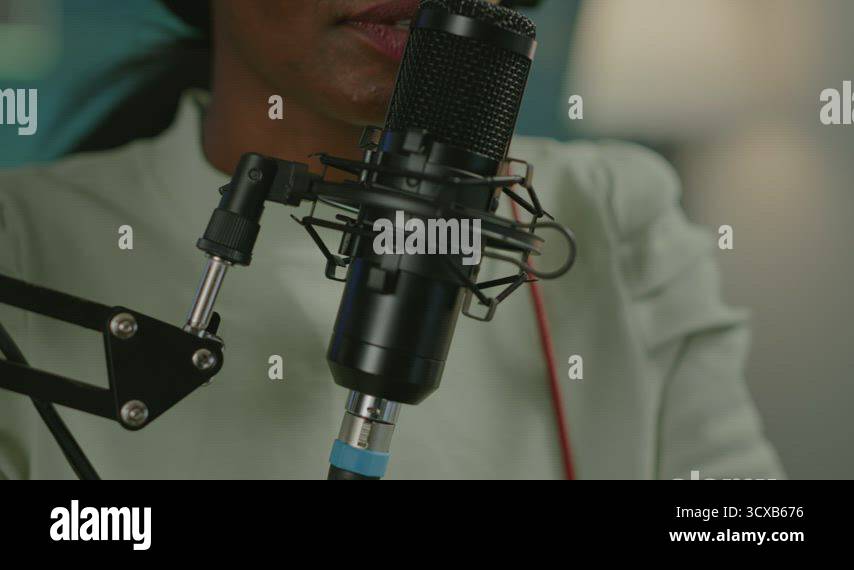 Close up of african influencer answering questions while talking into ...