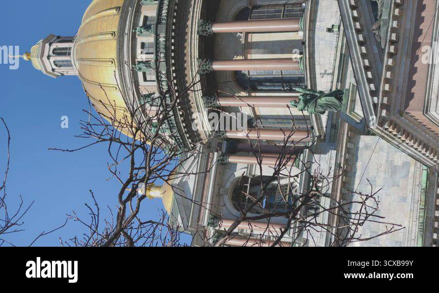 Vertical footage of Colonnade of St. Isaacs Cathedral through branches ...