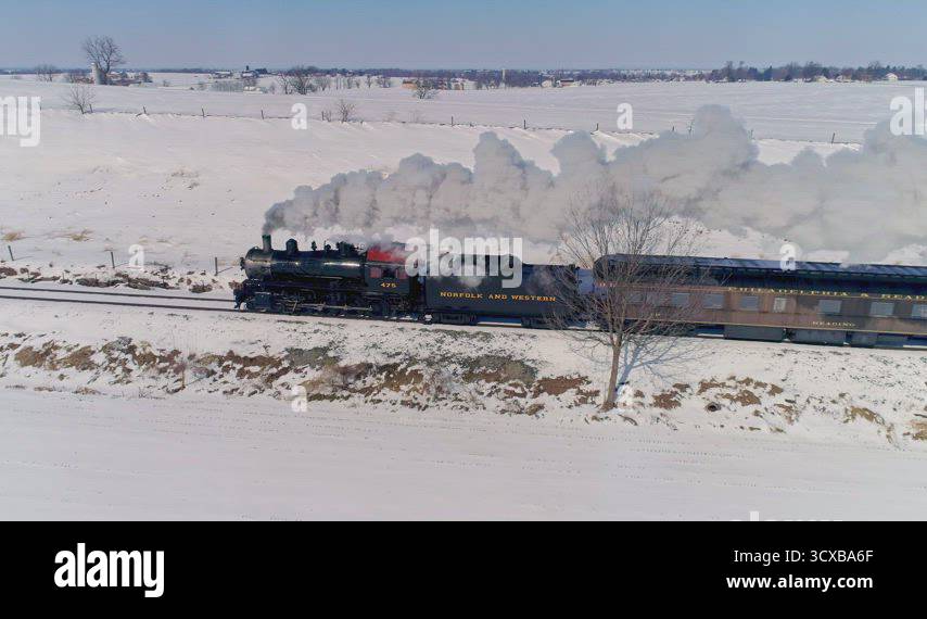 Aerial View of an Antique Steam Locomotive Approaching Pulling ...