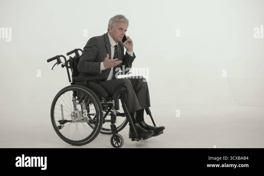 Paraplegic businessman on a wheelchair. Studio shot Stock Video Footage ...