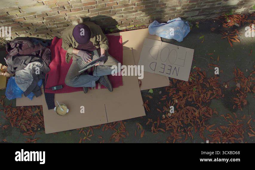 Top view of modern homeless man using laptop Stock Video Footage - Alamy