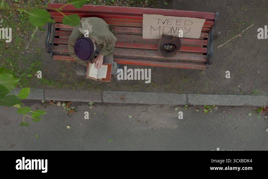 Homeless man sitting reading Stock Videos & Footage - HD and 4K Video ...