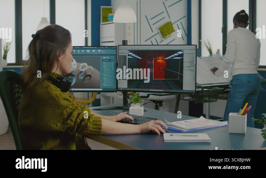 Engineer analysing cad software to develop video game Stock Video ...