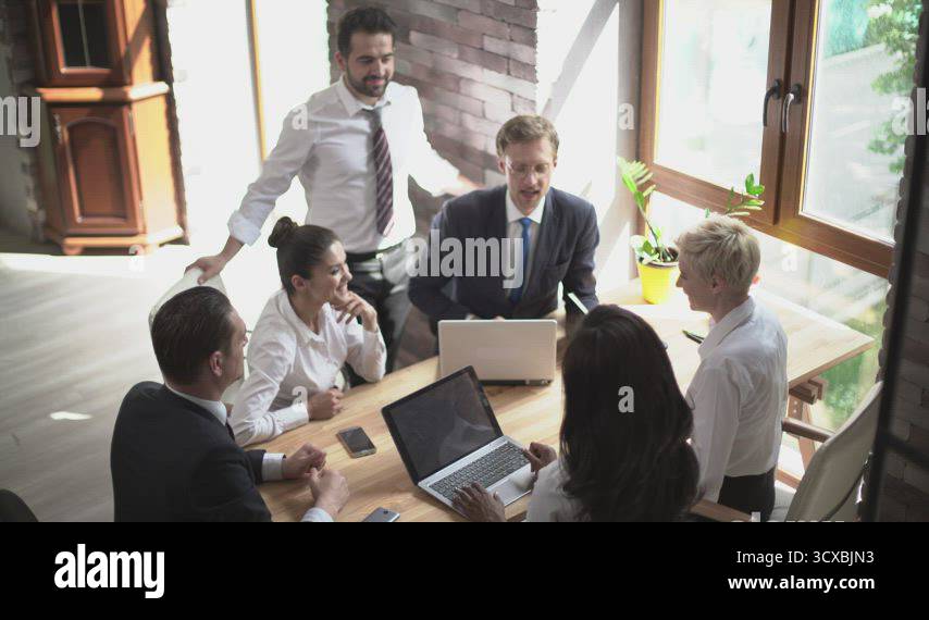 A Young Team of Business Partners are Preparing For An Important ...