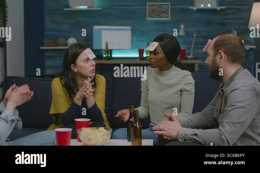 Multiracial group playing Guess who game with sticky papers Stock Video ...