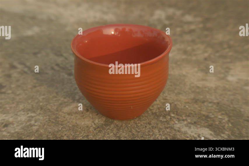 Empty Coffee cup (Bhar clay bowl) in bright sunset light. Summer fresh ...