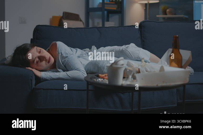 Unhappy depressed woman crying lying on sofa suffering from insomnia ...