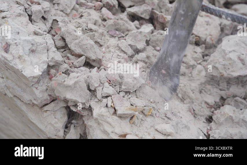 Punching solid concrete with a special jackhammer close-up, in slow ...