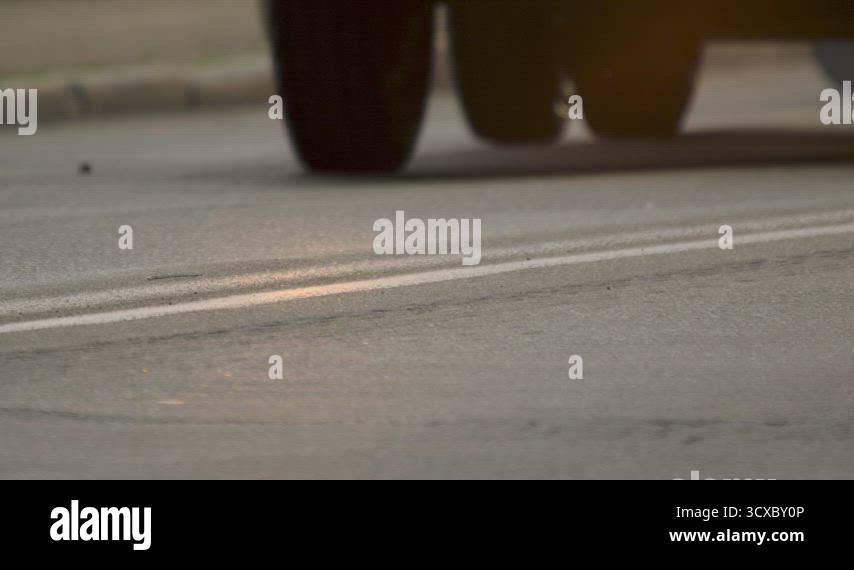 Busy city traffic highway moving wheel view car road city. Close up ...