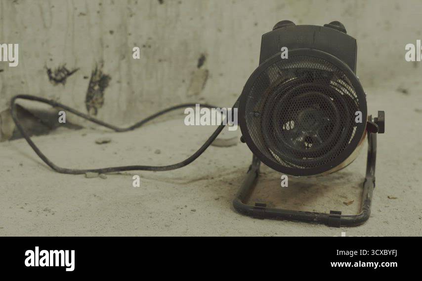 Plugging in and selecting the operating mode on the heater Stock Video ...