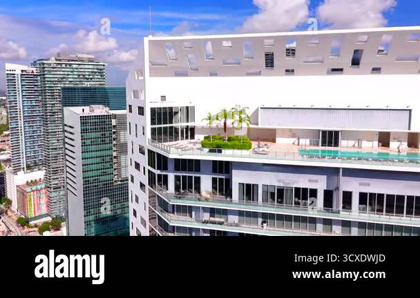 Miami, FL, USA - September 30, 2025: Aerial reveal rooftop swimming ...