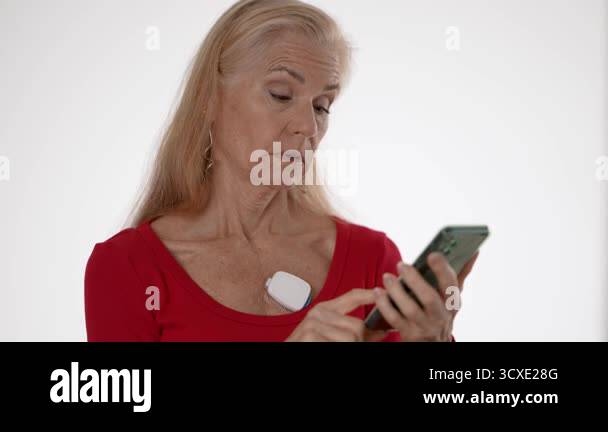 Unsure mature woman is wondering about monitoring her heart health ...