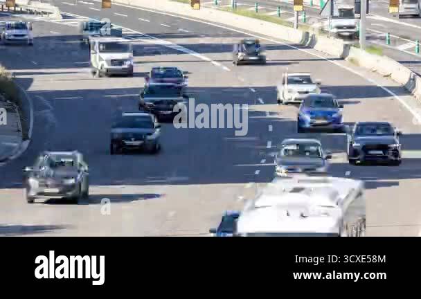 timelapse of traffic on a highway in barcelona during evening rush hour ...