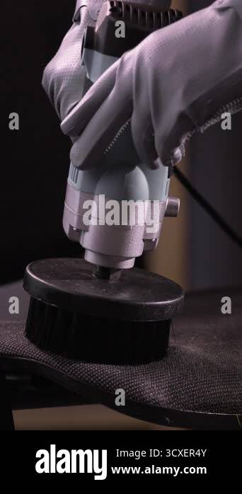 Dry cleaning soft furniture. Close Up of a dusting brush nozzle of a ...