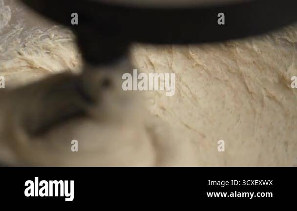 Kneading elastic dough for bread in a kneading machine in a bakery ...