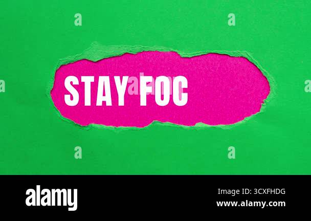 Stay Focused message written on ripped torn paper background ...