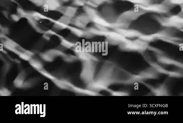 Rippling water surface of a pool in the dark, background pattern at ...