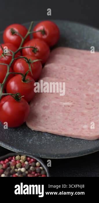 Spiced ham slices, canned meat for lunch sandwiches. Spiced ham as a ...