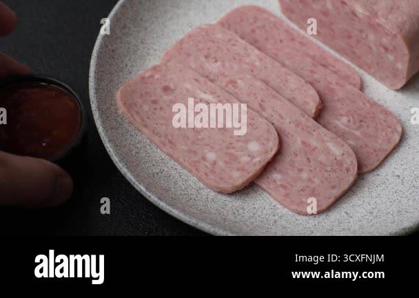 Spiced ham slices, canned meat for lunch sandwiches. Spiced ham as a ...