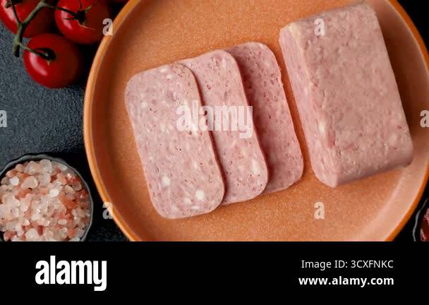 Spiced ham slices, canned meat for lunch sandwiches. Spiced ham as a ...