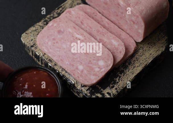 Spiced ham slices, canned meat for lunch sandwiches. Spiced ham as a ...