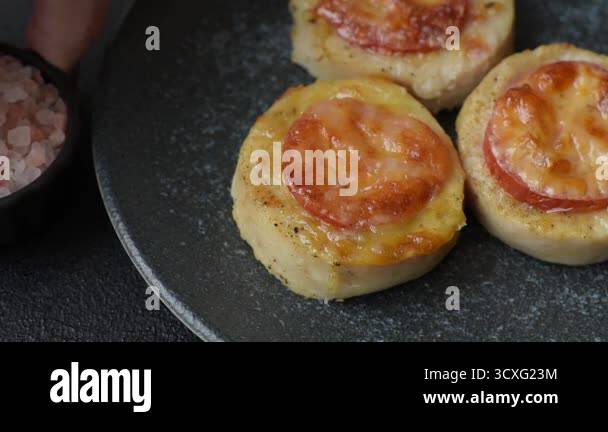 Round fish or chicken cutlets baked with tomato and cheese. Fish ...