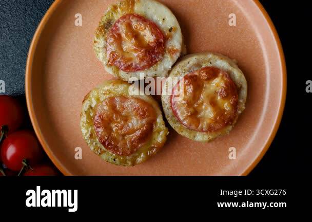Round fish or chicken cutlets baked with tomato and cheese. Fish ...