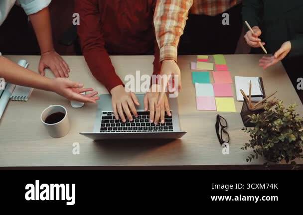 A collaborative team of professionals engages in a brainstorming ...