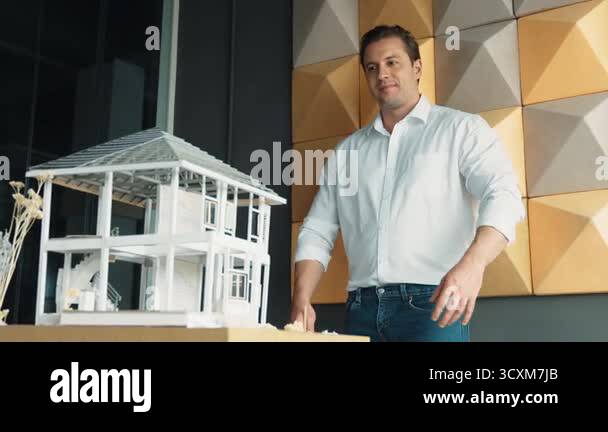 Professional smiling confident architect engineer looking at camera ...