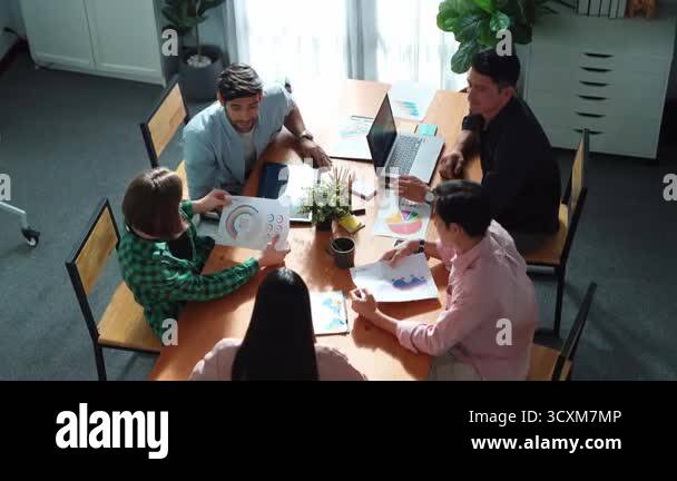 Top view of project manager present financial graph to investors at ...