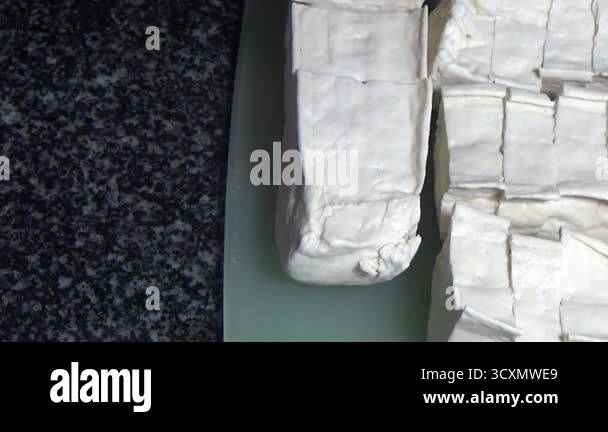 cut and fry the tofu Stock Video Footage - Alamy