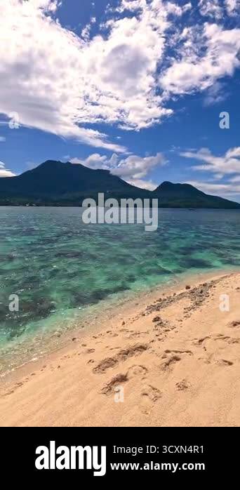 Point of view perspective of tropical beach, clear blue waters and ...