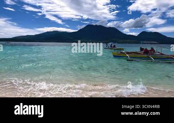 Point of view perspective of tropical beach, clear blue waters and ...
