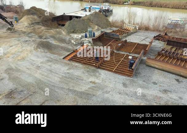 Above view dolly move around over workers as they cutting parts of old ...