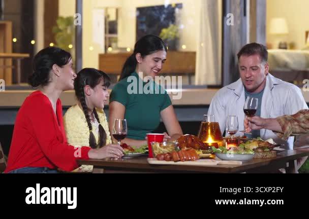 Family together for holiday celebration in garden. Family member gather ...