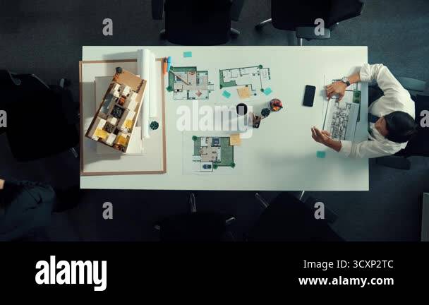 Top down aerial view of project manager using laptop to analysis ...
