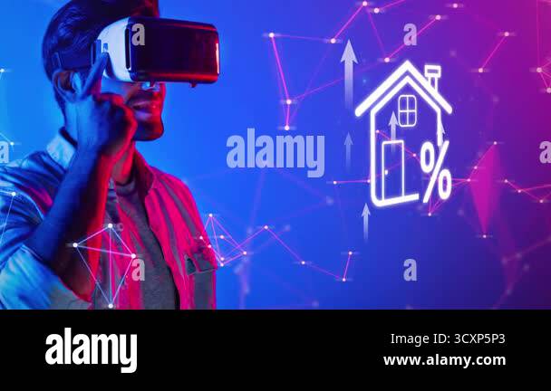 A man wears a virtual reality headset while exploring digital real estate growth symbols ...
