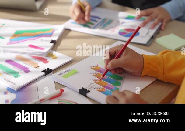 Startup company employee work together, analyze colorful BI dashboard ...