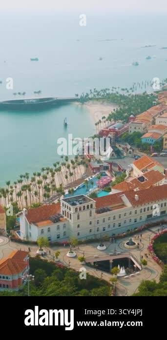 Aerial view of coastal city with Mediterranean style buildings, clock ...