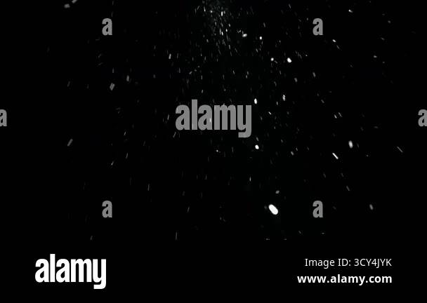 Snowfall in the dark night sky with white flakes gently falling ...