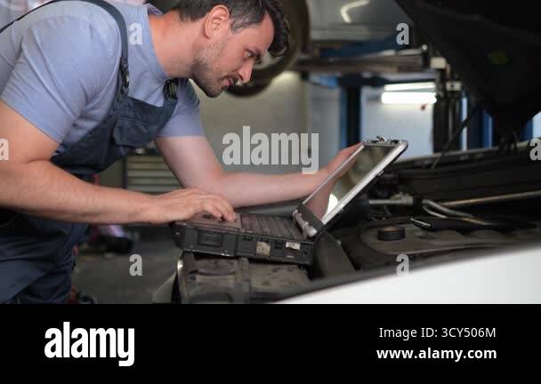 Mechanic using computer auto repair Stock Videos & Footage - HD and 4K ...