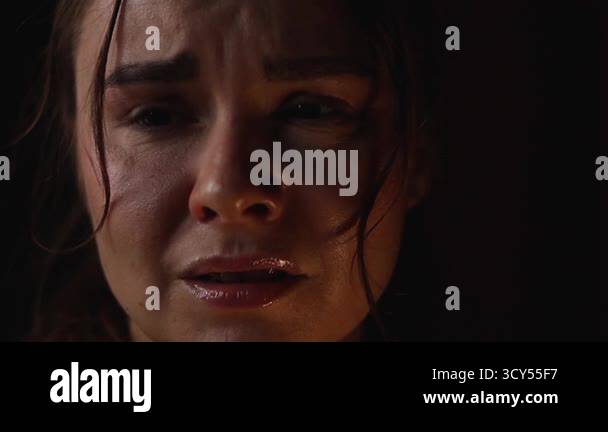 Portrait of an emotional woman crying in the red light Stock Video ...
