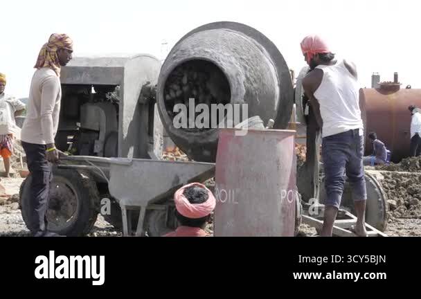 Cement Mixing in Action - A Crew of Workers Ensuring Strong Foundations ...