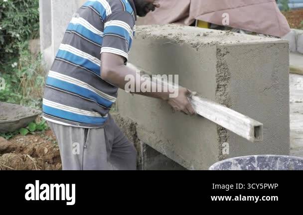 Efficient Cement Laying in Progress - Skilled Worker Perfecting Cement ...
