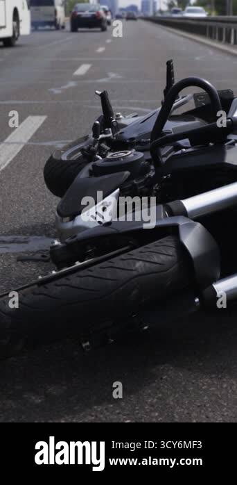 The motorcycle lies on the sidewalk after a ride. Serious accident ...