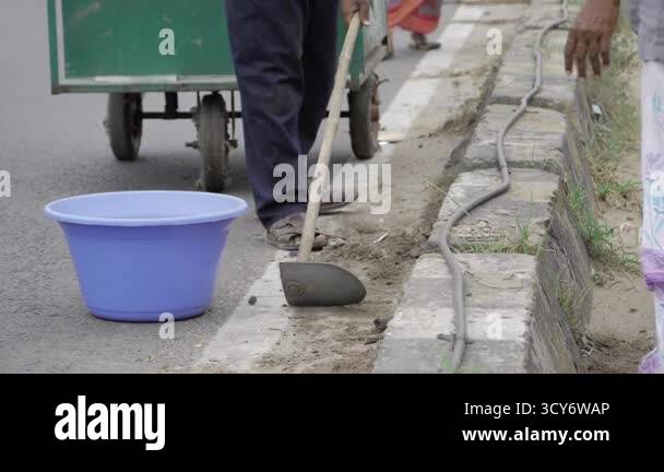 Diligent Street Cleaner in Action - Keeping Indian Roads Sparkling ...