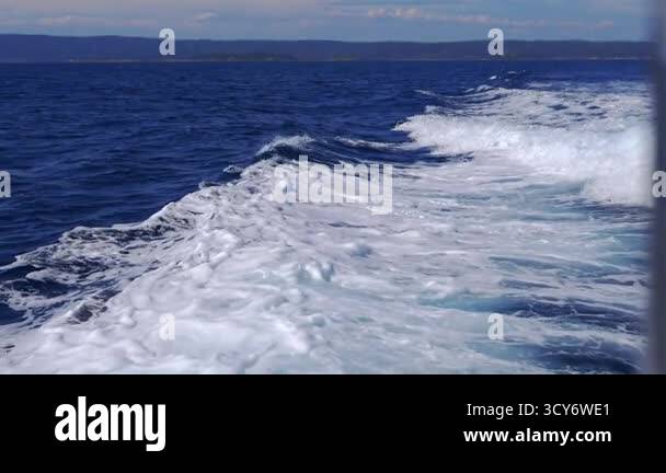 Close-up of dynamic foamy sea waves crashing and raging in the Aegean ...