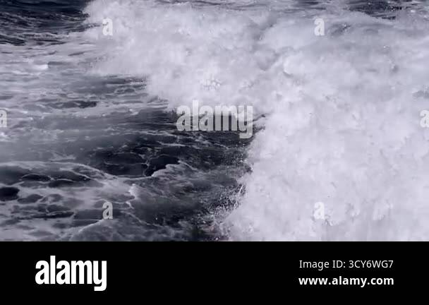 Close-up of dynamic foamy sea waves crashing and raging in the Aegean ...