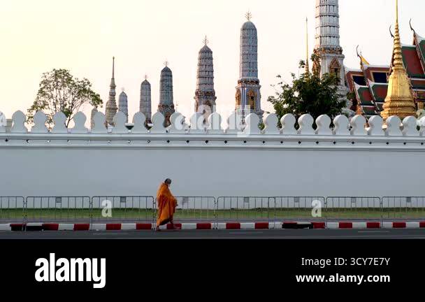 Bangkok Thailand 22 September 2024, An orange-clad monk walks ...